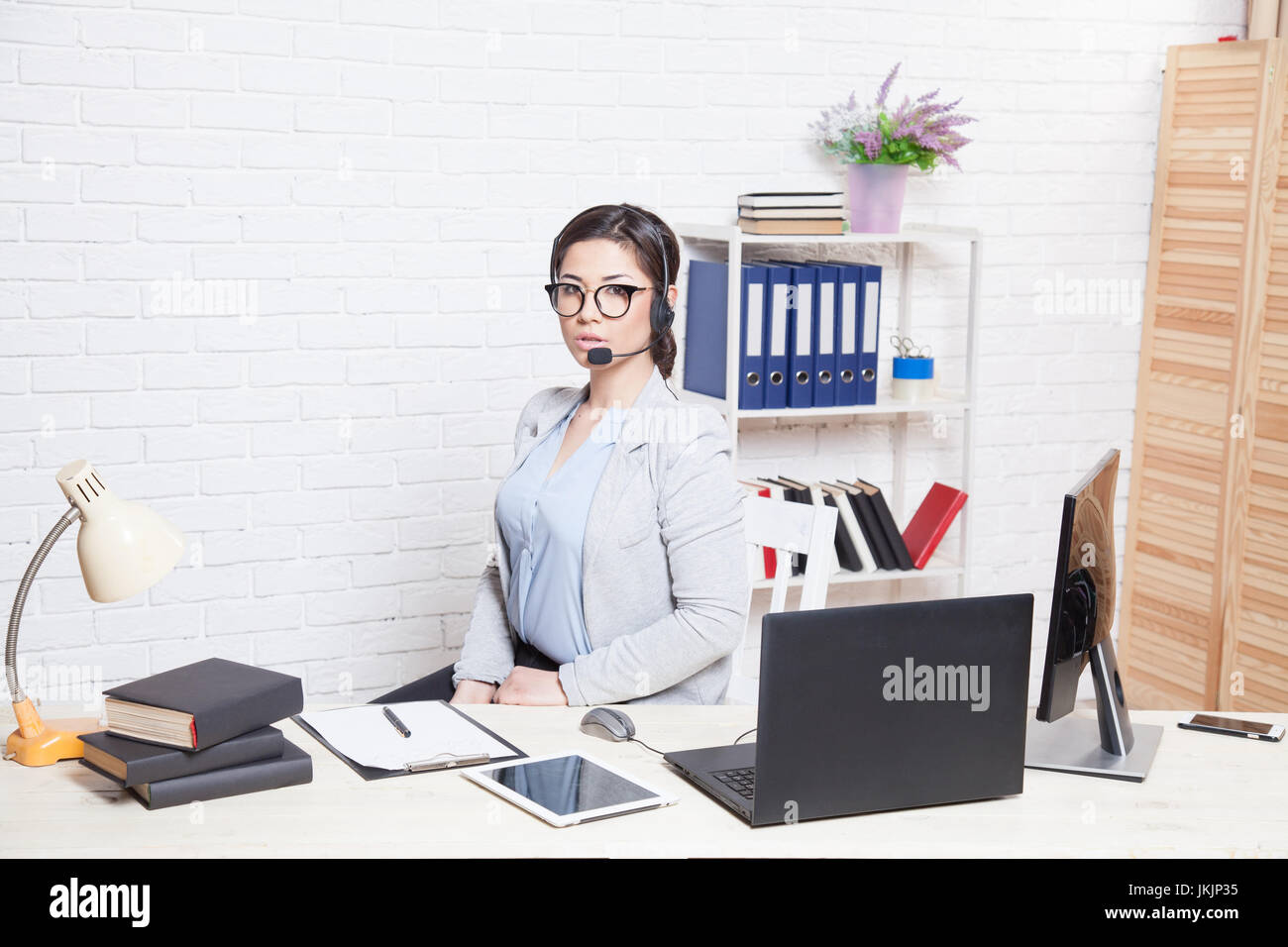 Call Center operator works at the computer in the Office Stock Photo ...