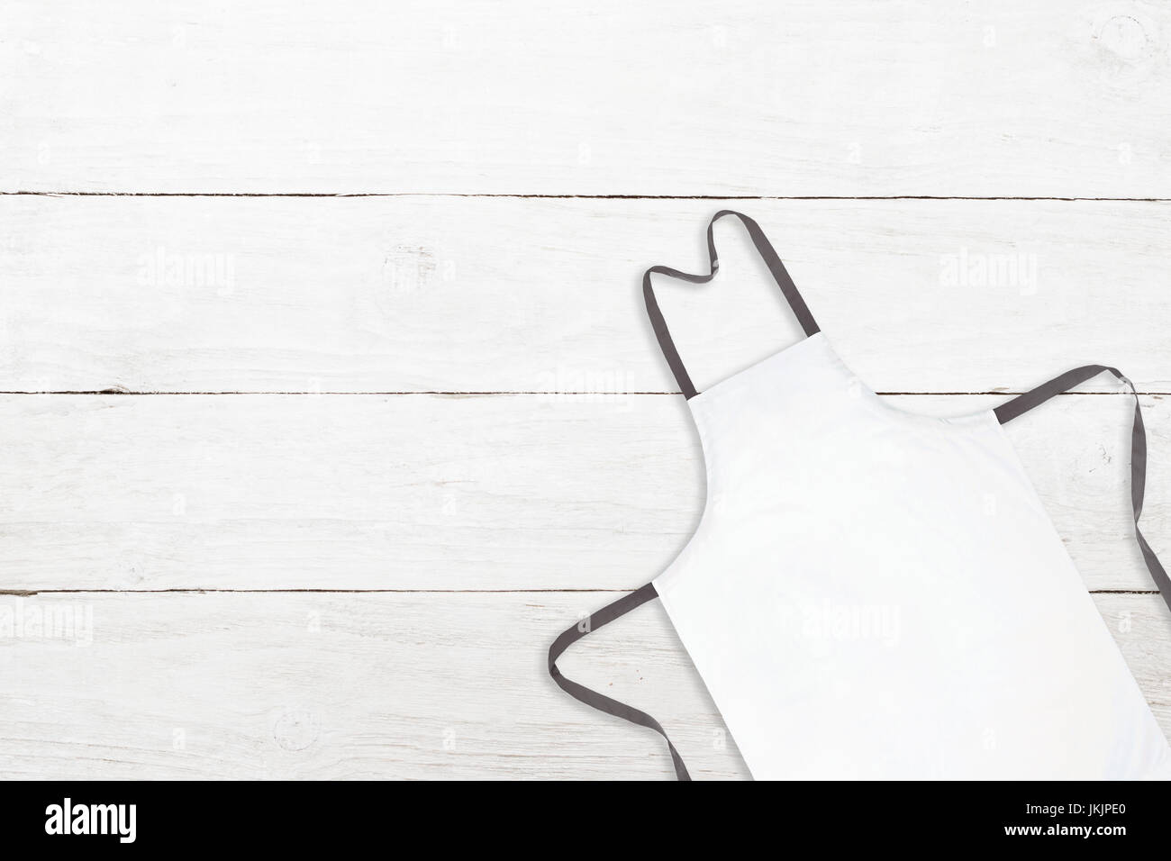 White apron on white background Stock Photo - Alamy