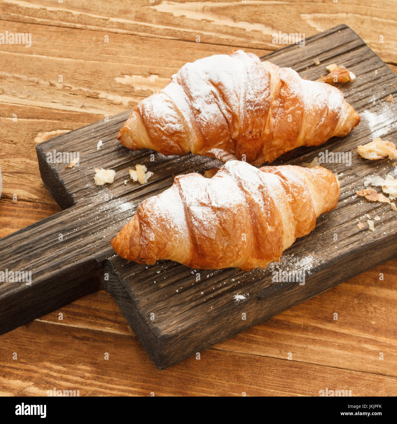 Close-up croissants on wooden cutting board Stock Photo - Alamy