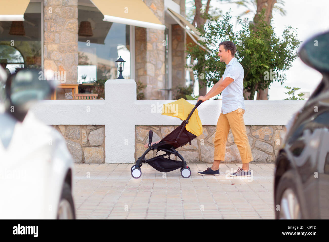 Father pushing buggy hi-res stock photography and images - Alamy
