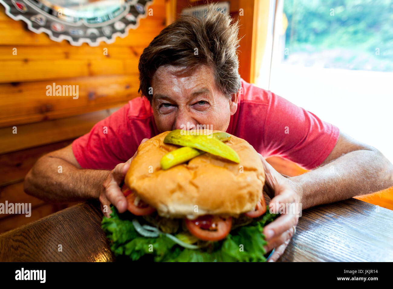 Trying to eat a two pound hamburger at Denny's Beer Barrel Pub Stock ...