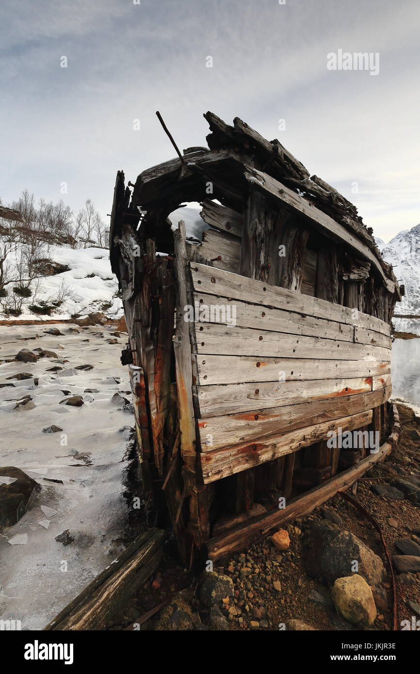Shipwrecked wooden boat stranded-Sildpolltjonna bay bottom-S.shore ...