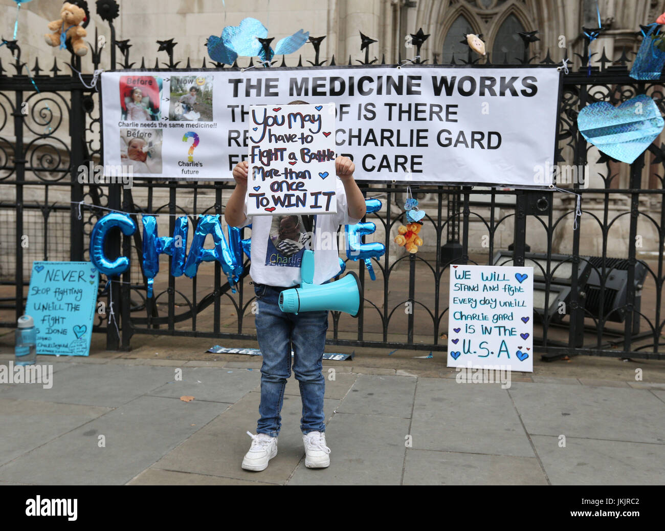 A Charlie Gard supporter outside the Royal Courts of Justice in London ...
