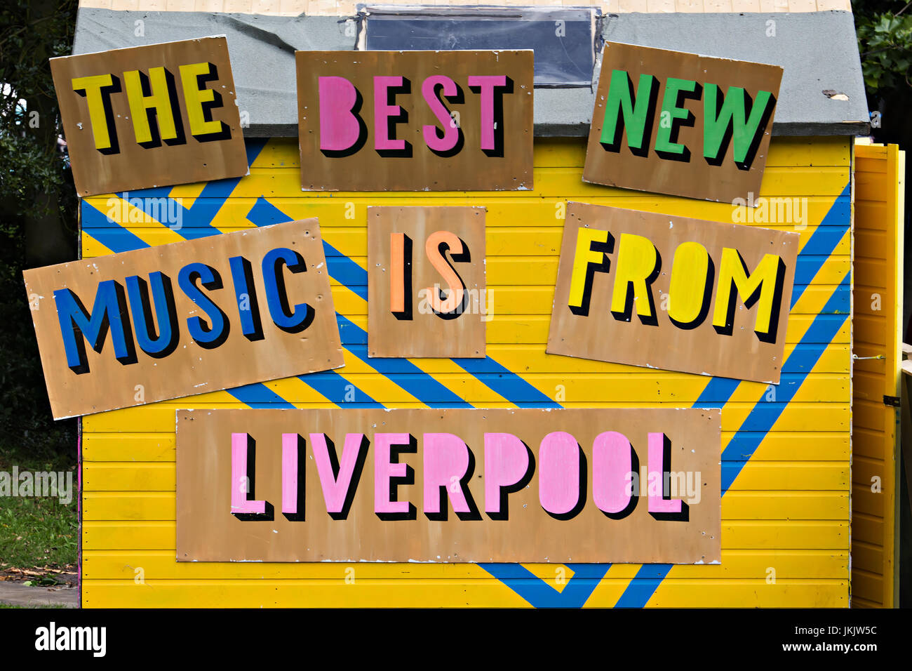 The Best New Music is From Liverpool signs on a yellow garden shed at ...