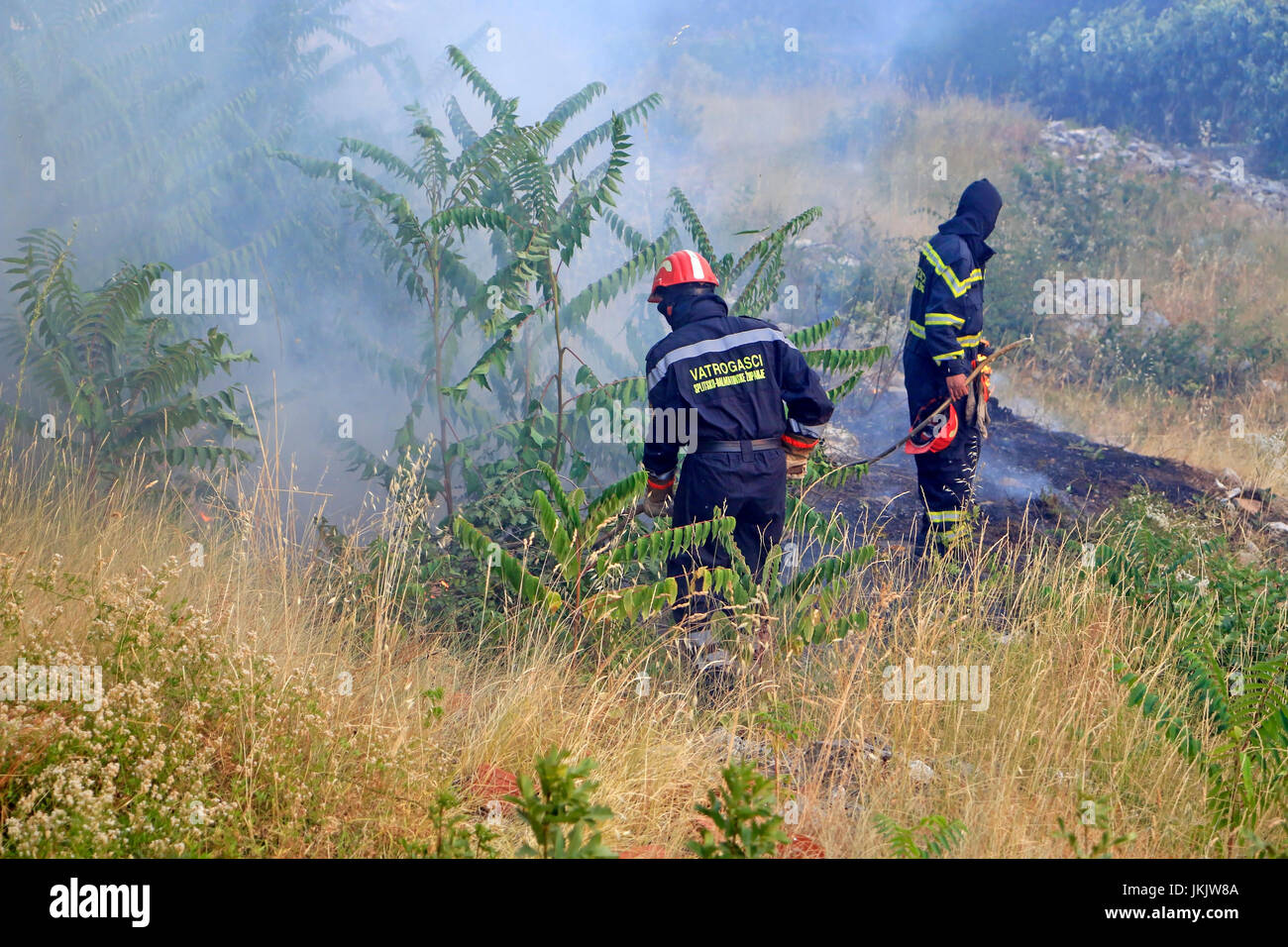 Zrnovnica, Split, Croatia - July 17, 2017: Firefighters gasing the fire ...