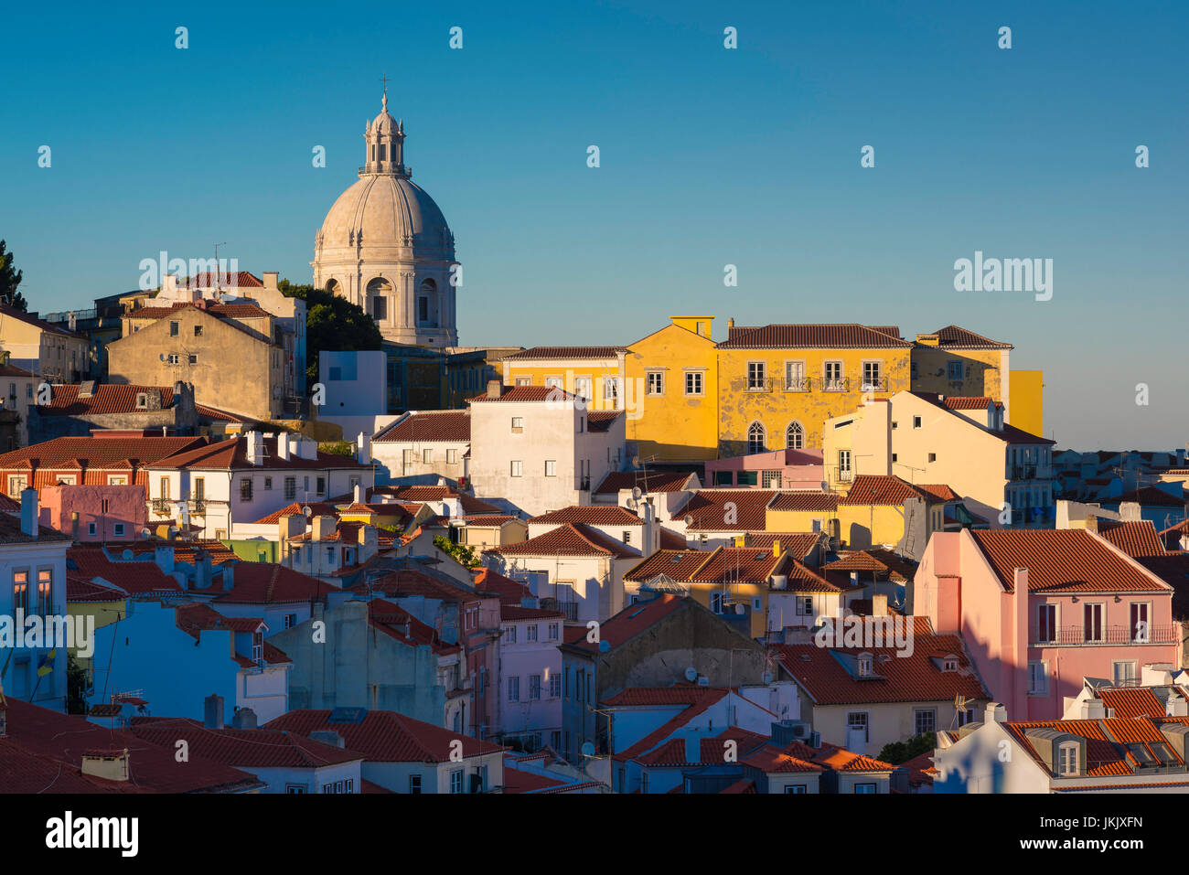 Lisbon cityscape, view of the Alfama skyline at sunset with the dome of ...