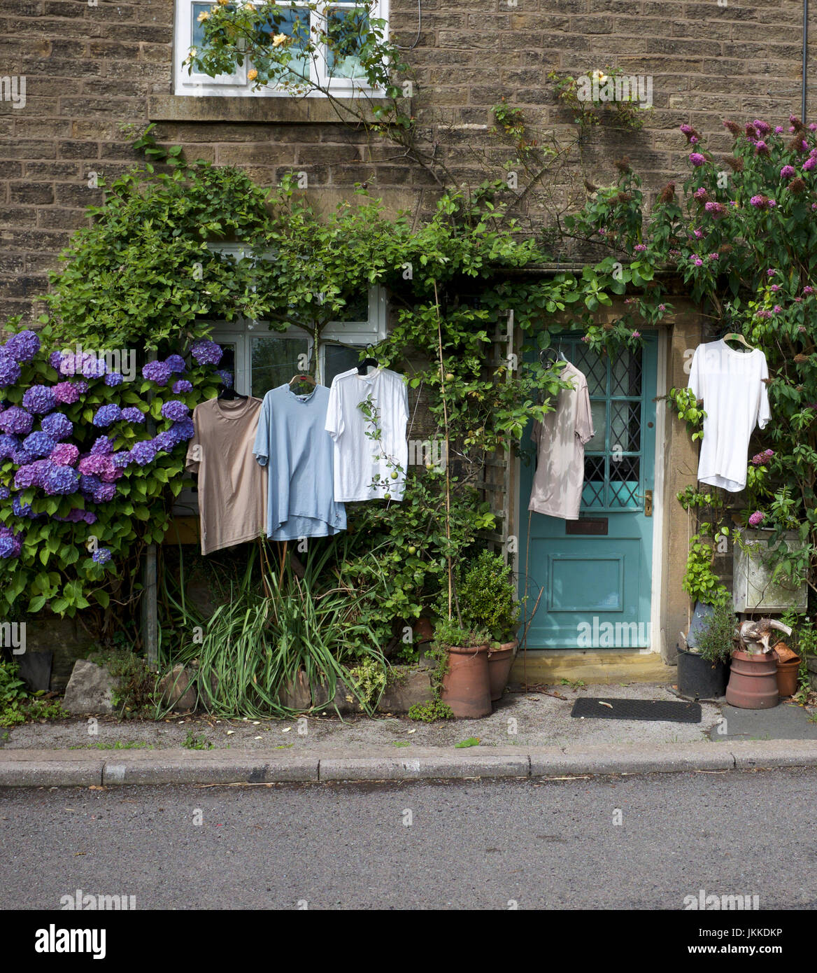 Clothes hang to dry outside a terraced house Stock Photo - Alamy
