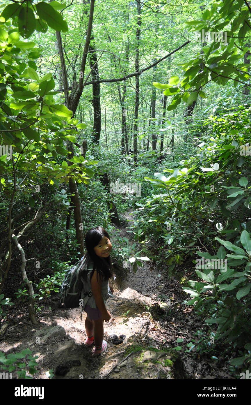 Girl hiking on a trail Stock Photo - Alamy