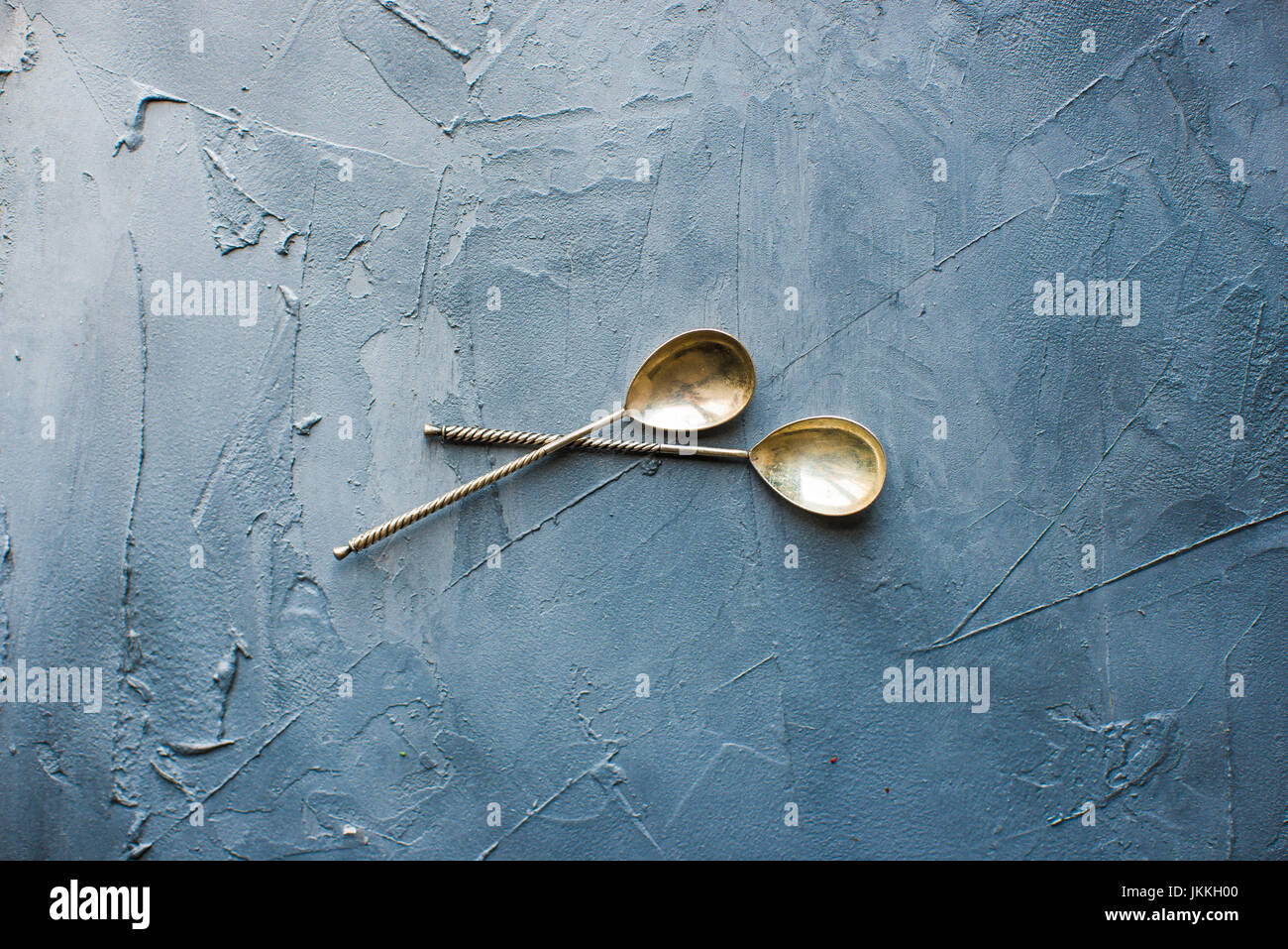 Table setting with vintage spoons on grey concrete background Stock ...