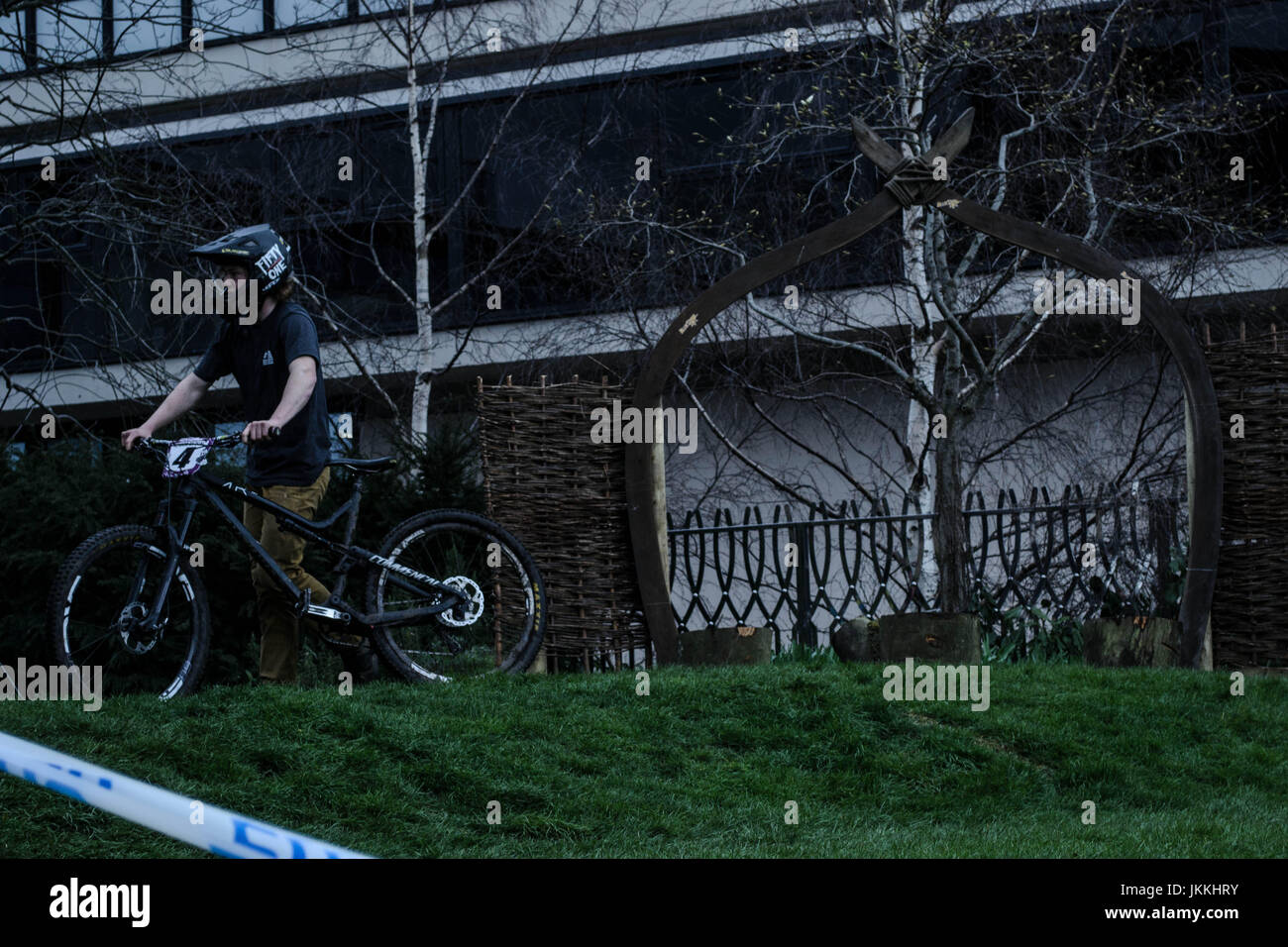 Mountain Bike riders flying down a hill on a street in Sheffield city ...