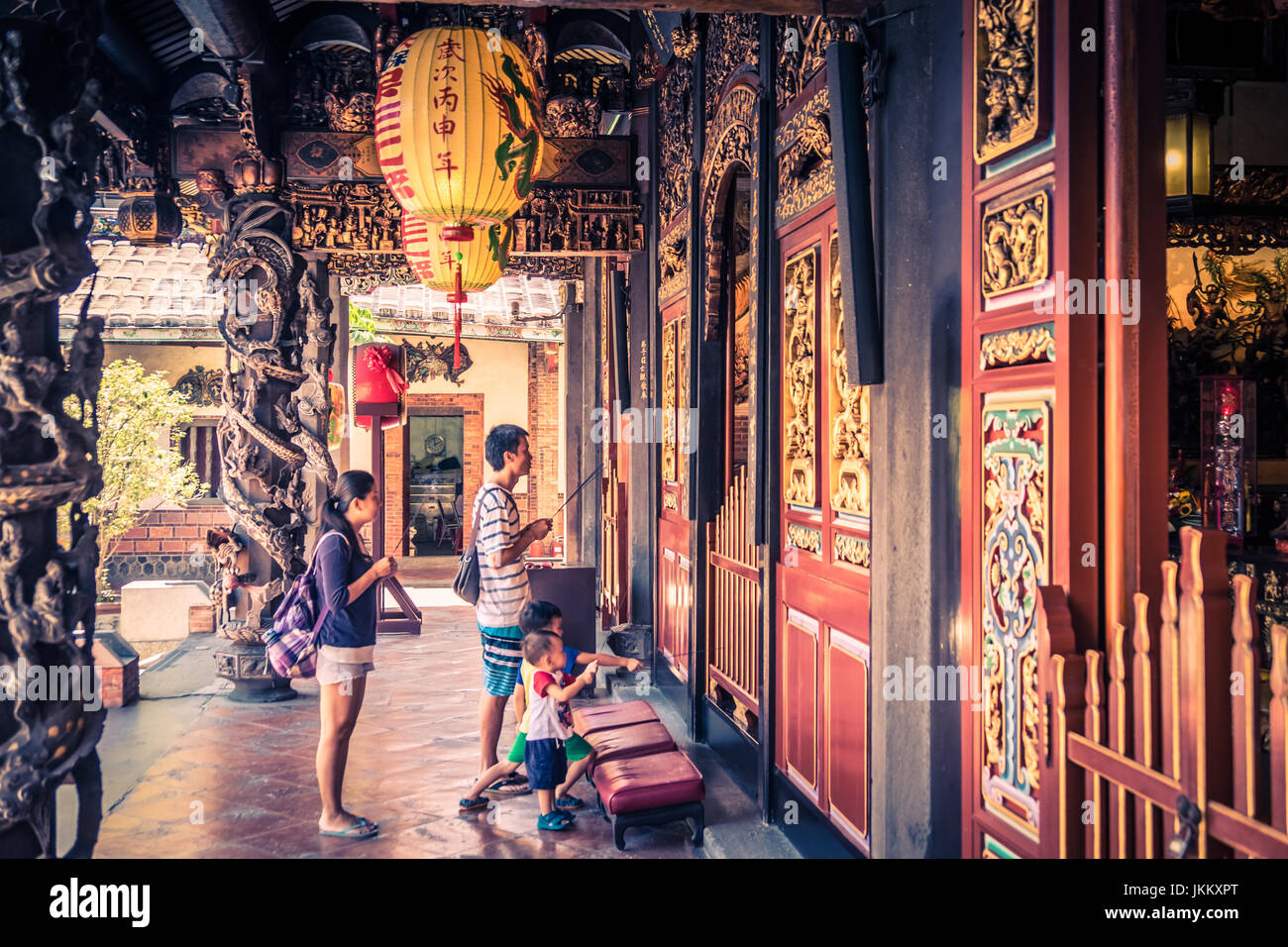 Family praying in a Chinese temple in Taipei - August 2016 Stock Photo ...