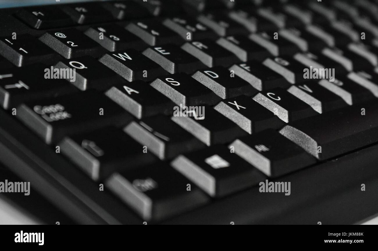 Angled view of black personal computer keyboard Stock Photo - Alamy