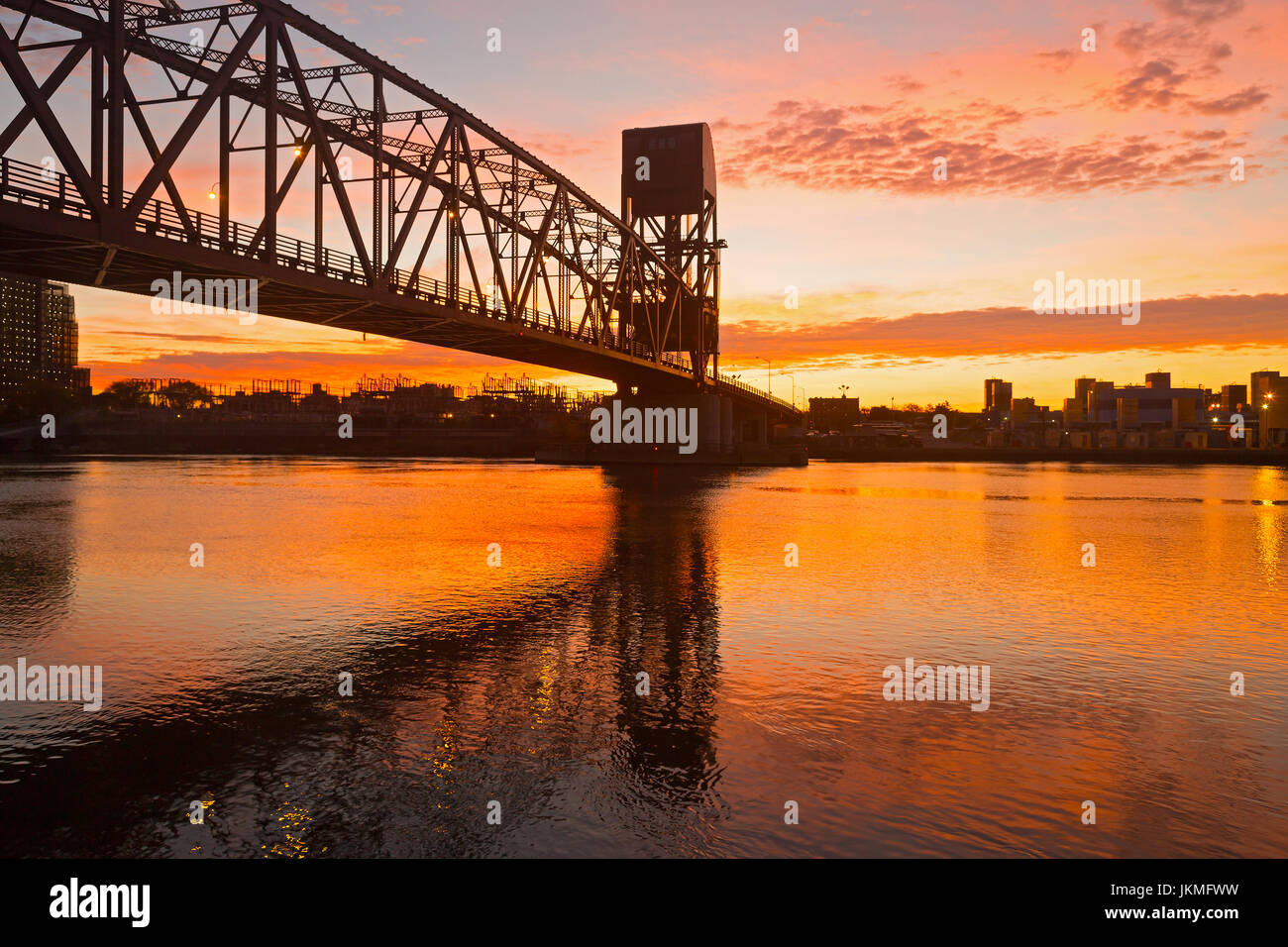 Scarlet sunrise with Roosevelt Island Bridge across the East Channel in ...