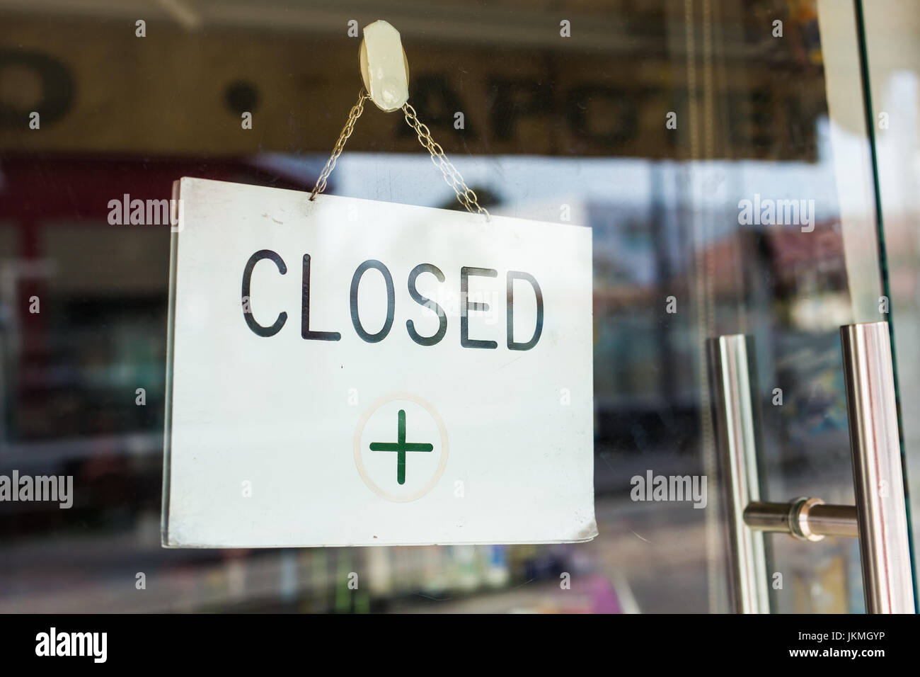 Closed sign hanging in a shop window Stock Photo - Alamy