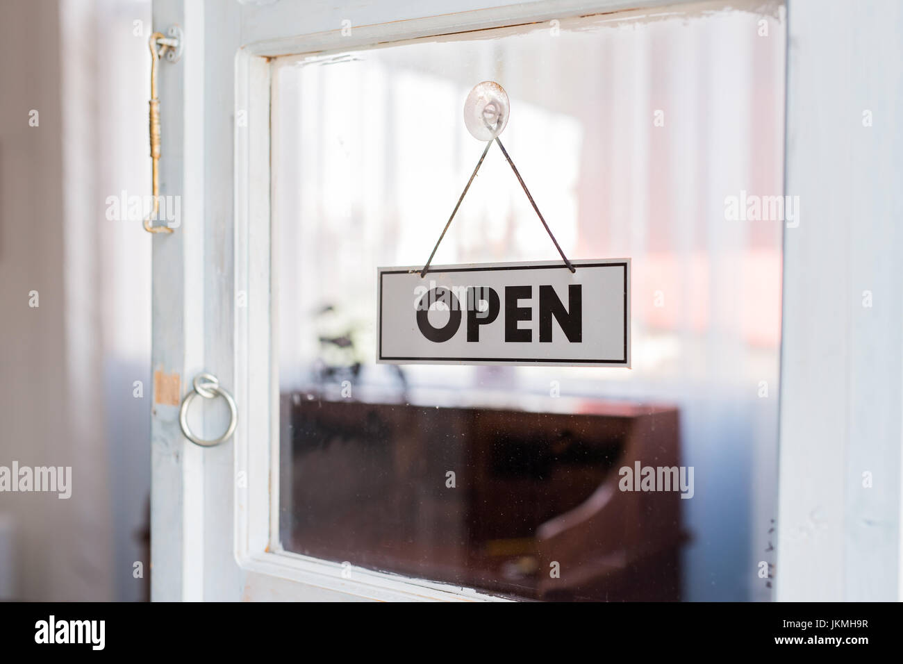 Open sign hanging in a shop window Stock Photo - Alamy