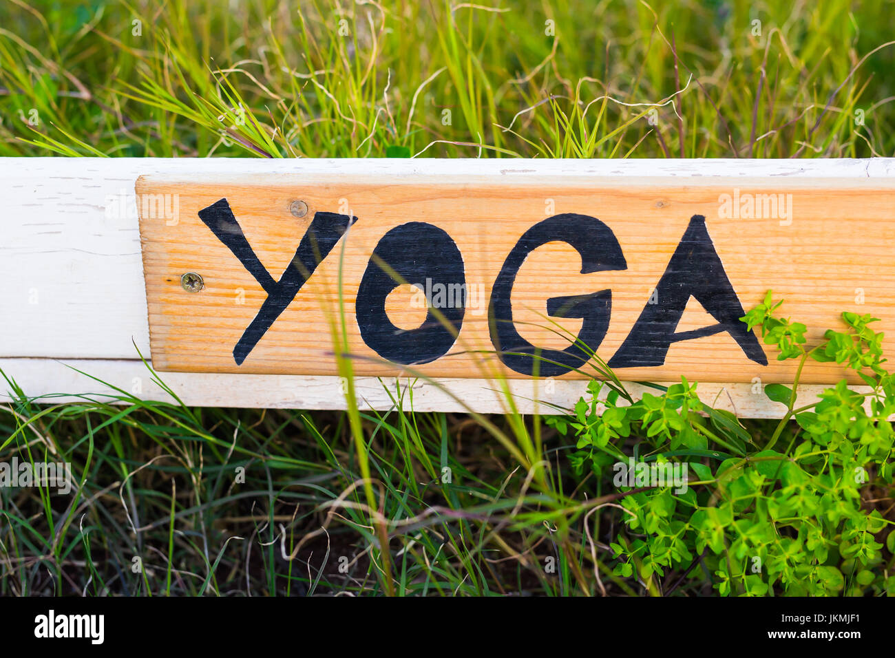 Sign with word yoga, signboard Stock Photo - Alamy