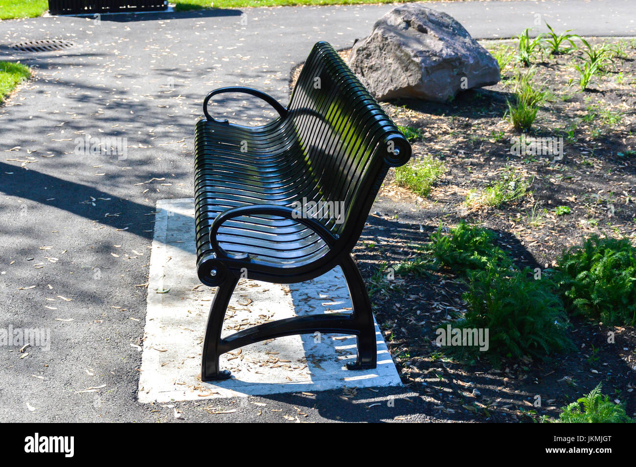 The black iron bench in the public park, Montreal, Canada Stock Photo ...