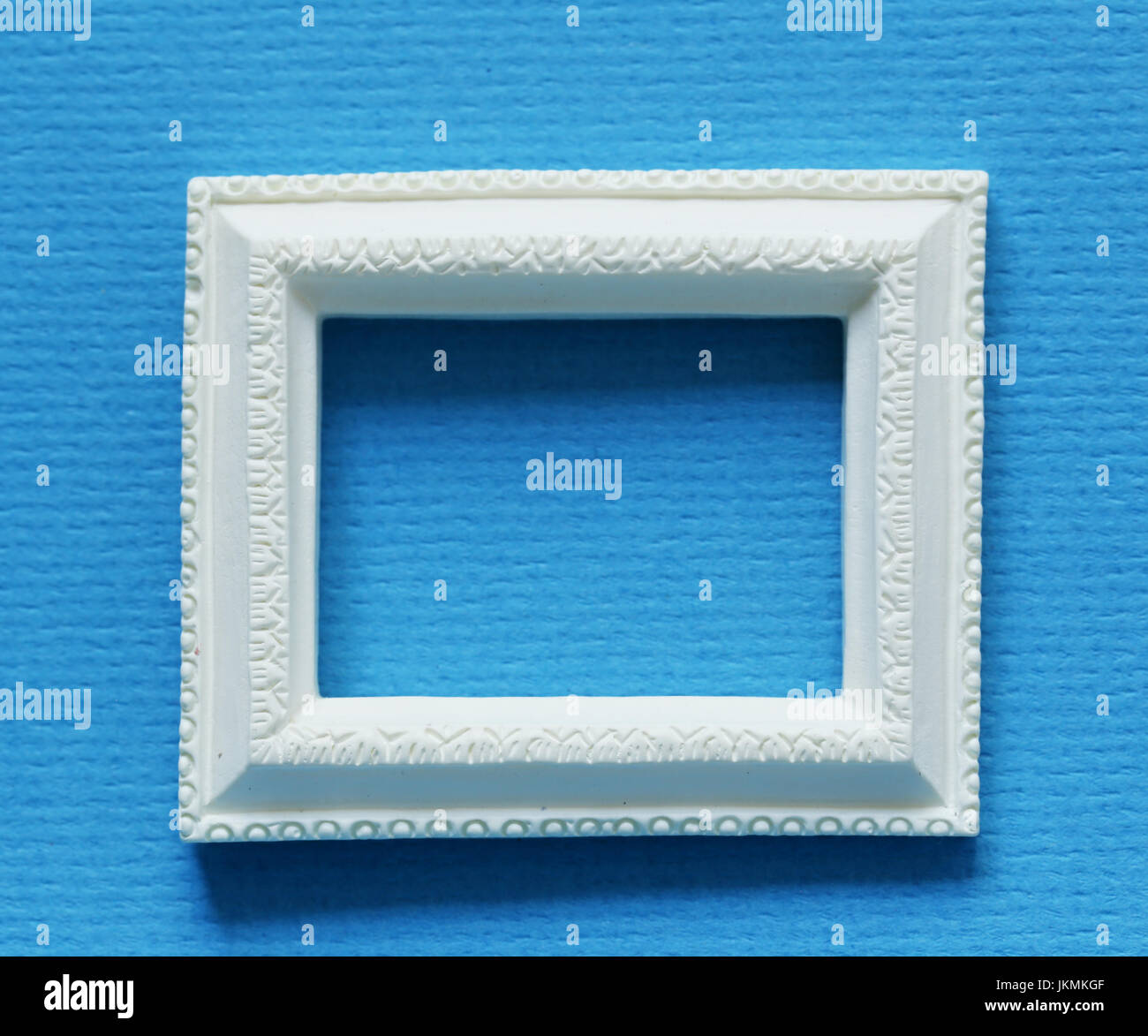 White gypsum frame on a blue background Stock Photo - Alamy
