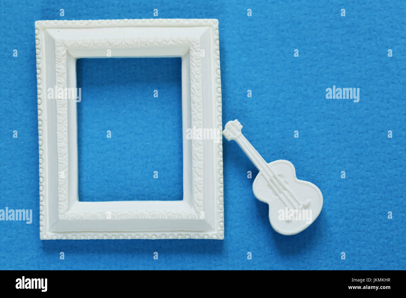 White gypsum frame on a blue background Stock Photo - Alamy