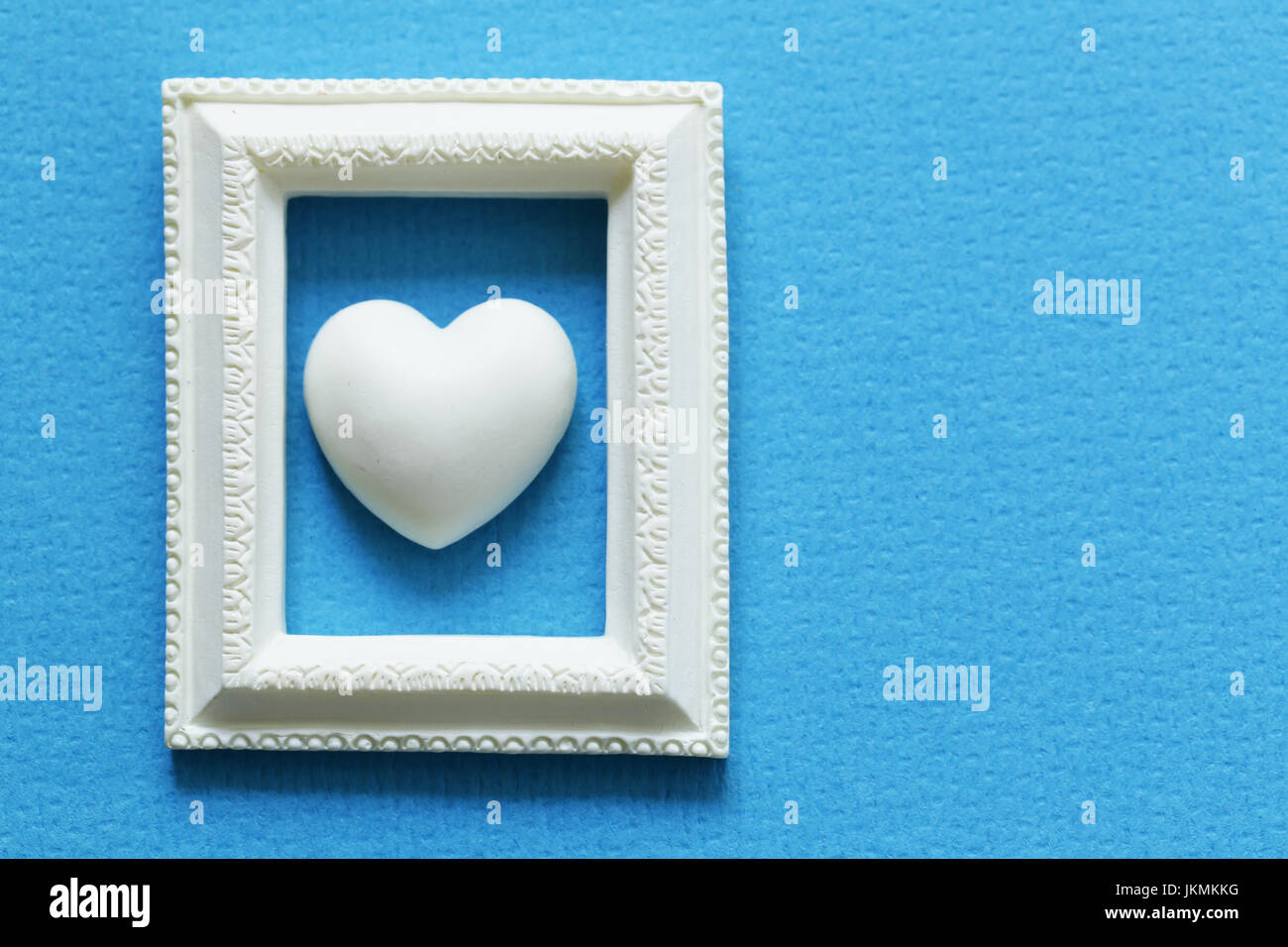 White gypsum frame on a blue background Stock Photo - Alamy