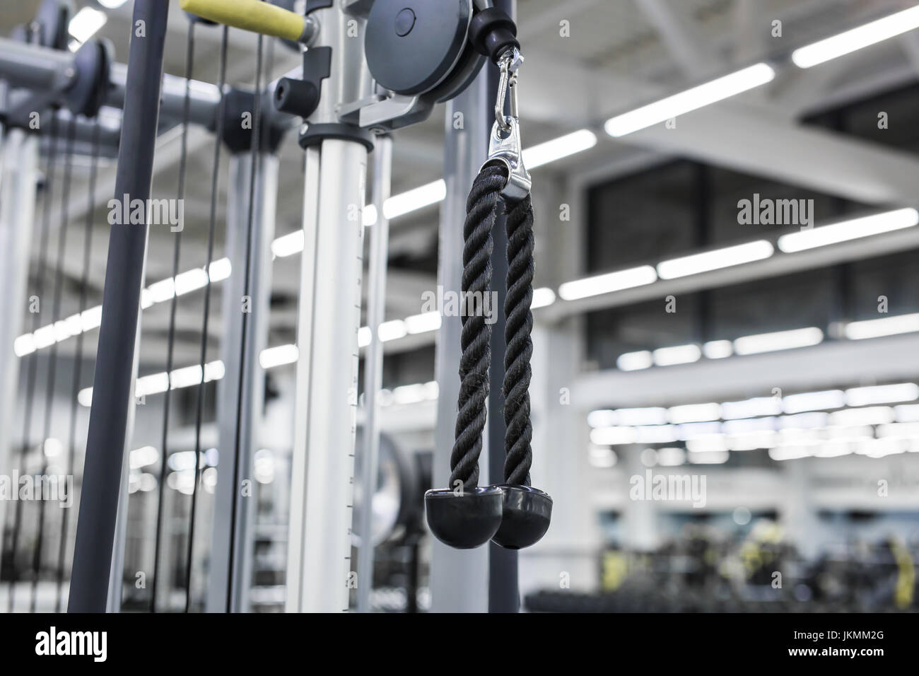 Closeup picture of hanging handle machine in a gym for pulling training ...