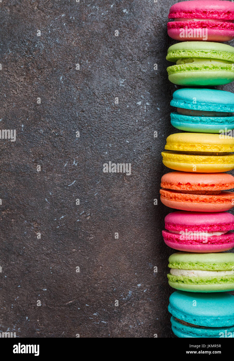 Colorful macaroons on stone table. Sweet macarons. Top view with copy ...