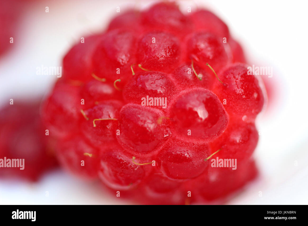 A background of ripe red raspberry with milk Stock Photo - Alamy