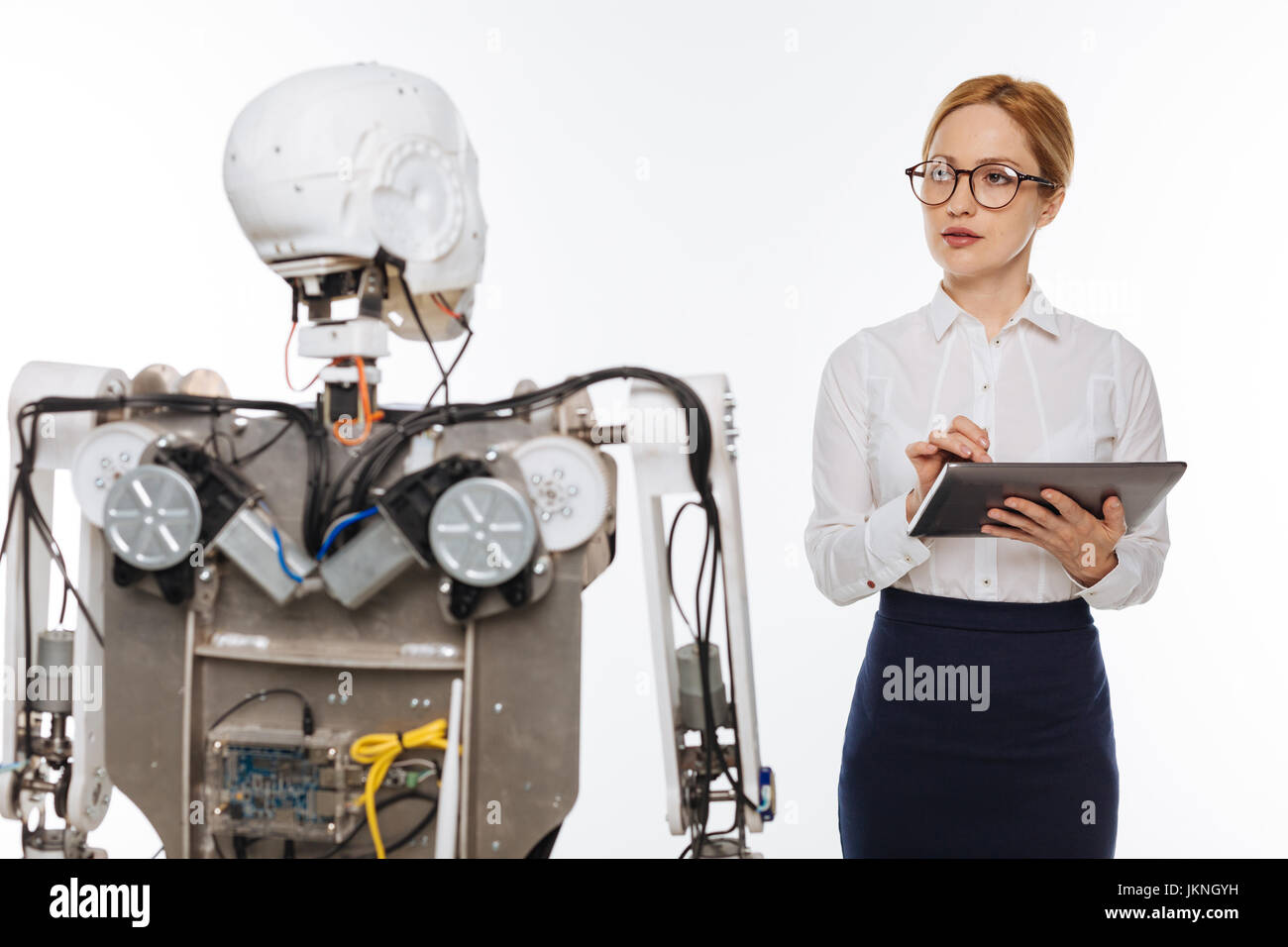 Dedicated bright woman collecting data about artificial intelligence ...