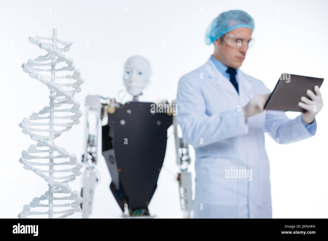 Competent thoughtful scientist busy working in a lab Stock Photo - Alamy