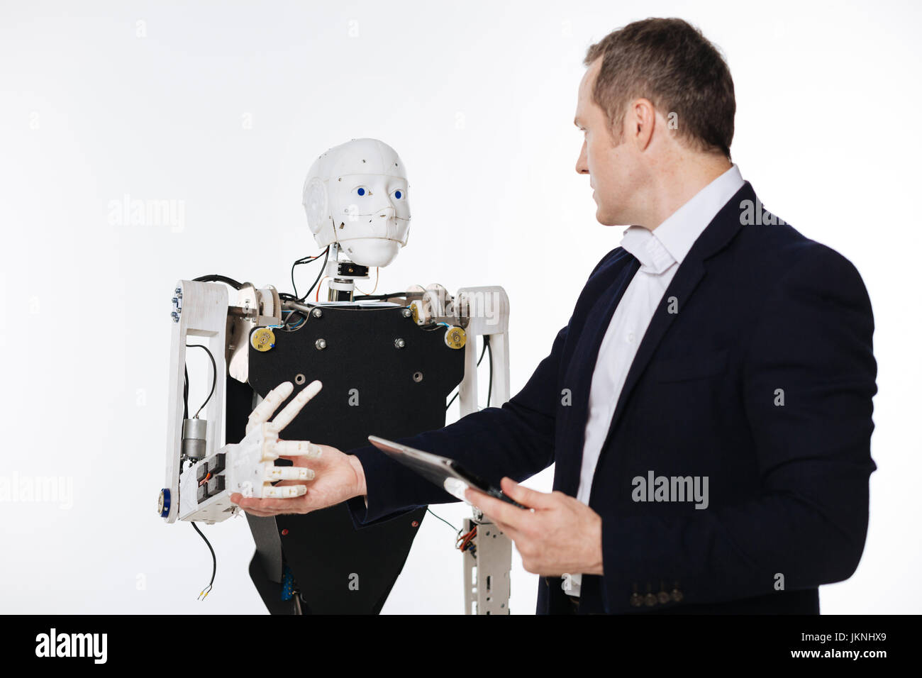 Dynamic enthusiastic scientist testing machine reflexes Stock Photo - Alamy