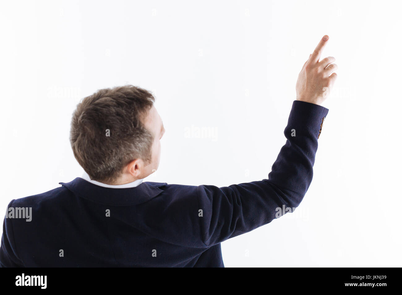 Curious elegant gentleman pointing his finger up Stock Photo - Alamy