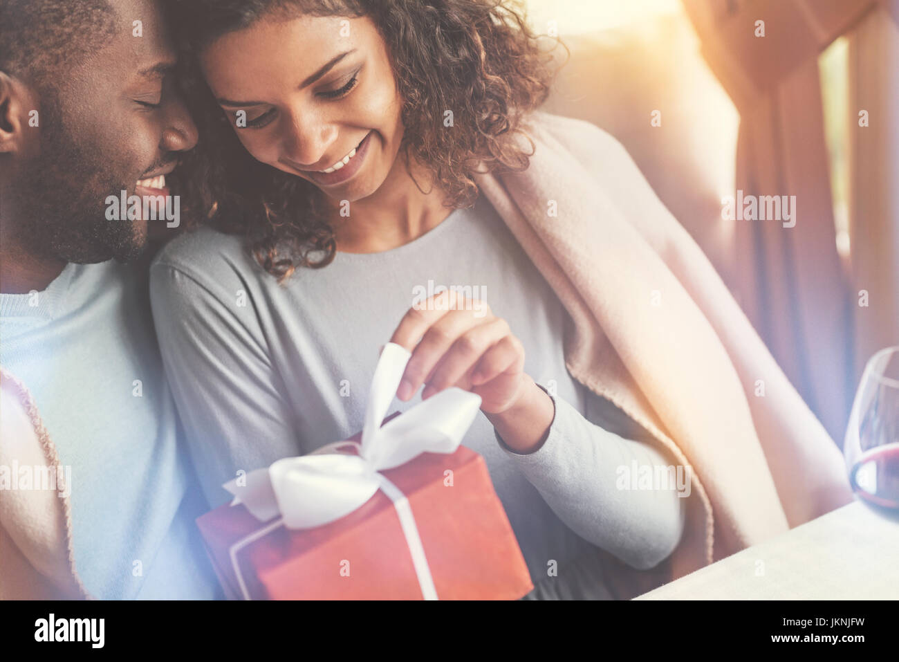 Unwrapping present couple hi-res stock photography and images - Alamy