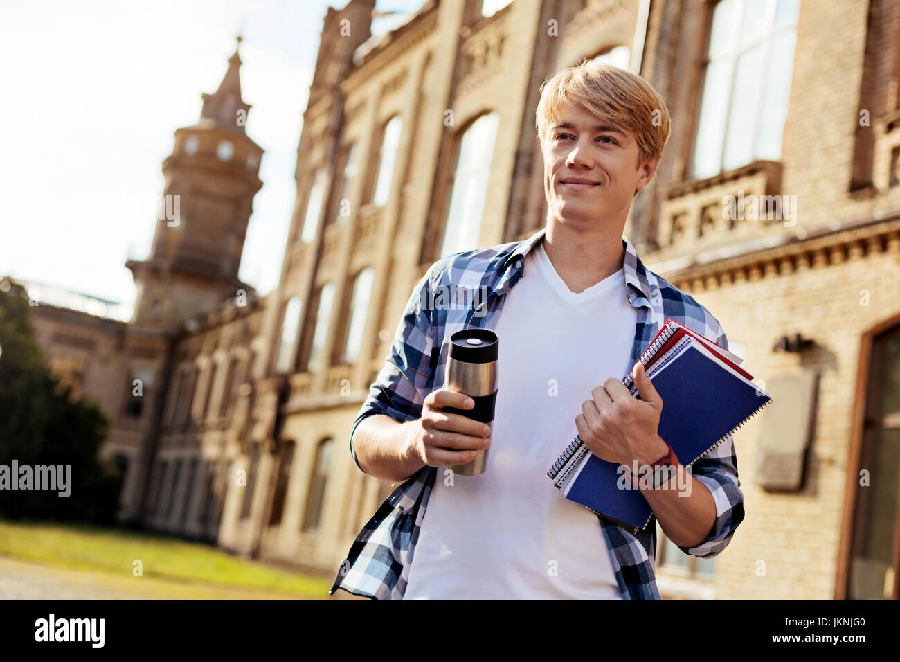Clever enthusiastic guy beginning another year of study Stock Photo - Alamy