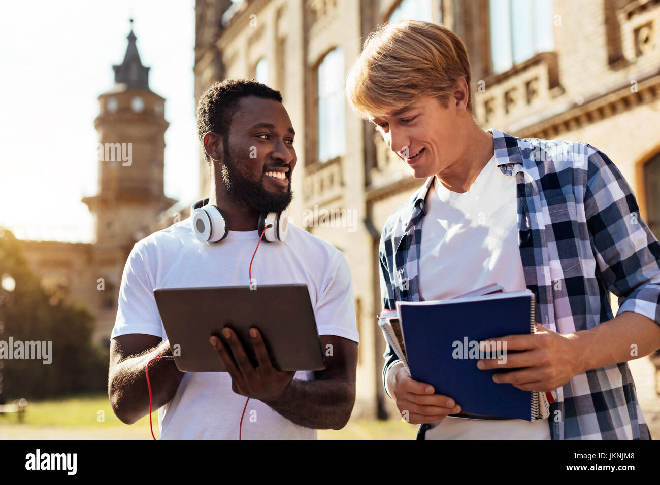 Ambitious savvy man showing something on his tablet Stock Photo - Alamy