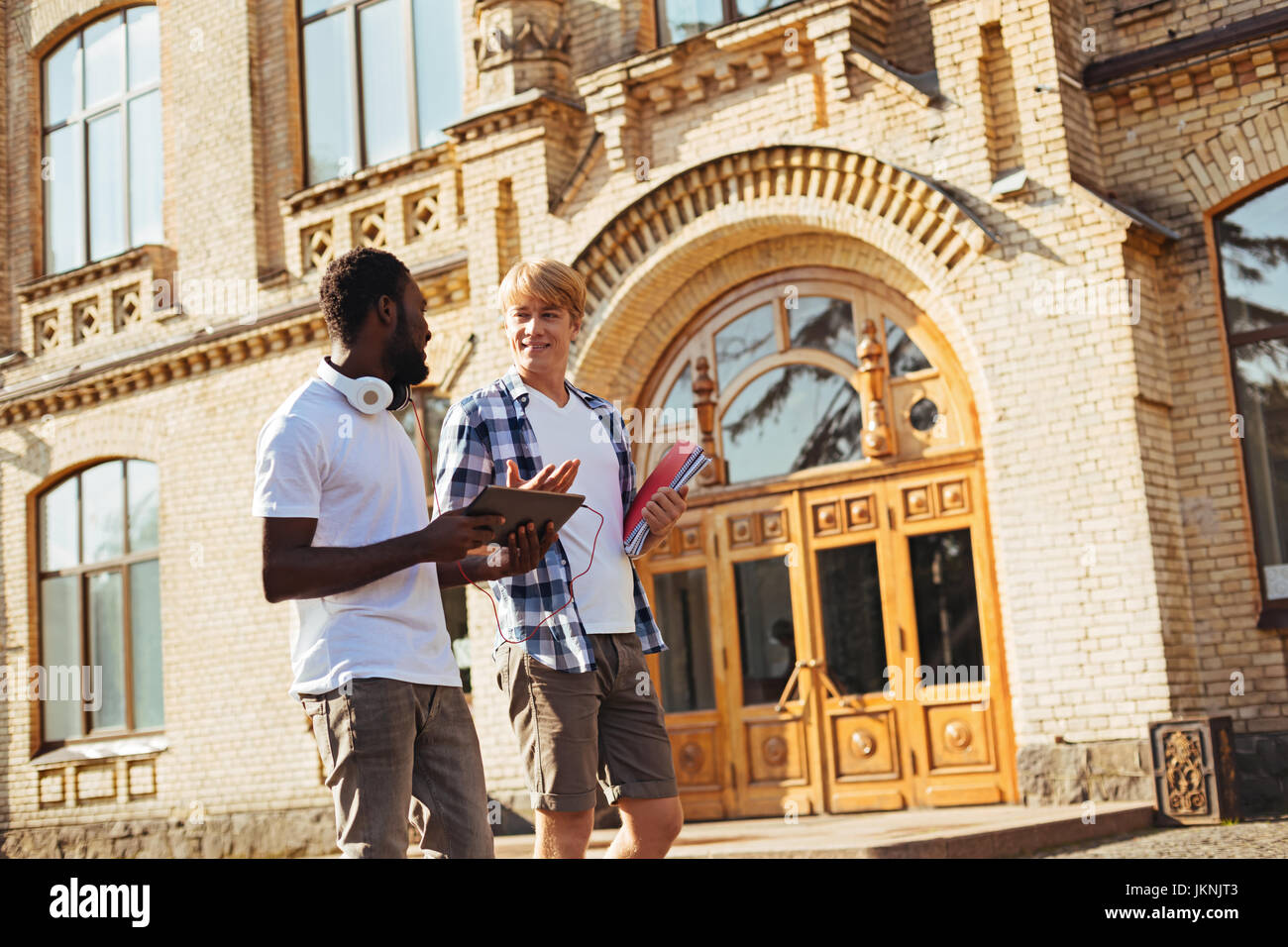 Dedicated positive students heading to the next class Stock Photo - Alamy