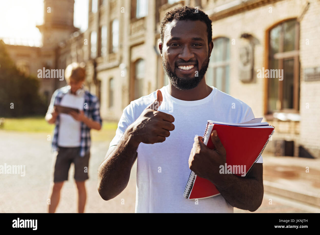 Passionate positive man enjoying his study Stock Photo - Alamy