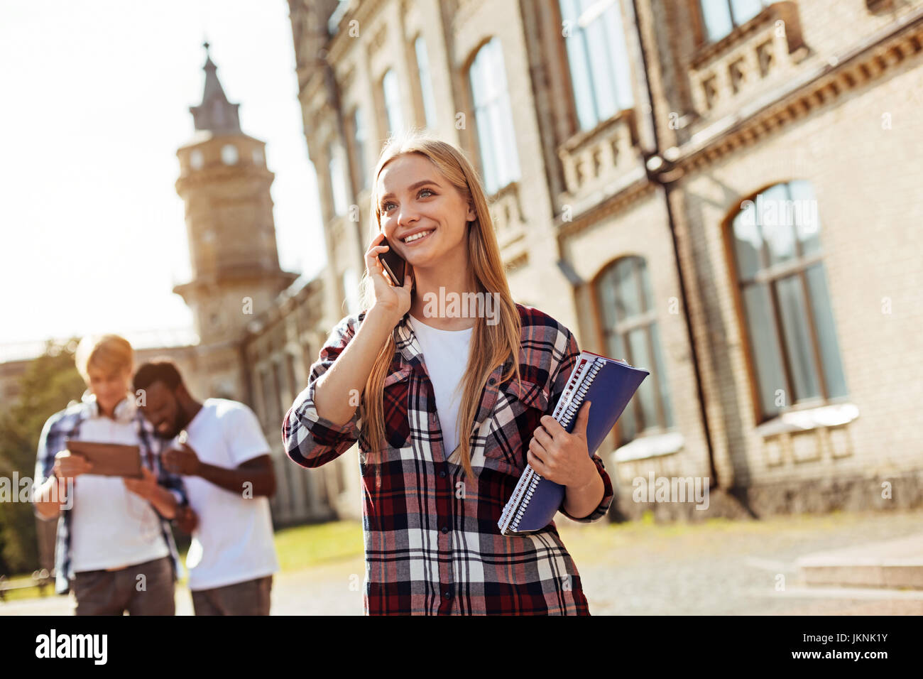 Easy going attractive woman waiting for her friend Stock Photo - Alamy
