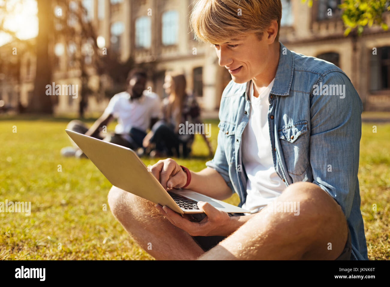 Cheerful committed man searching for information Stock Photo - Alamy