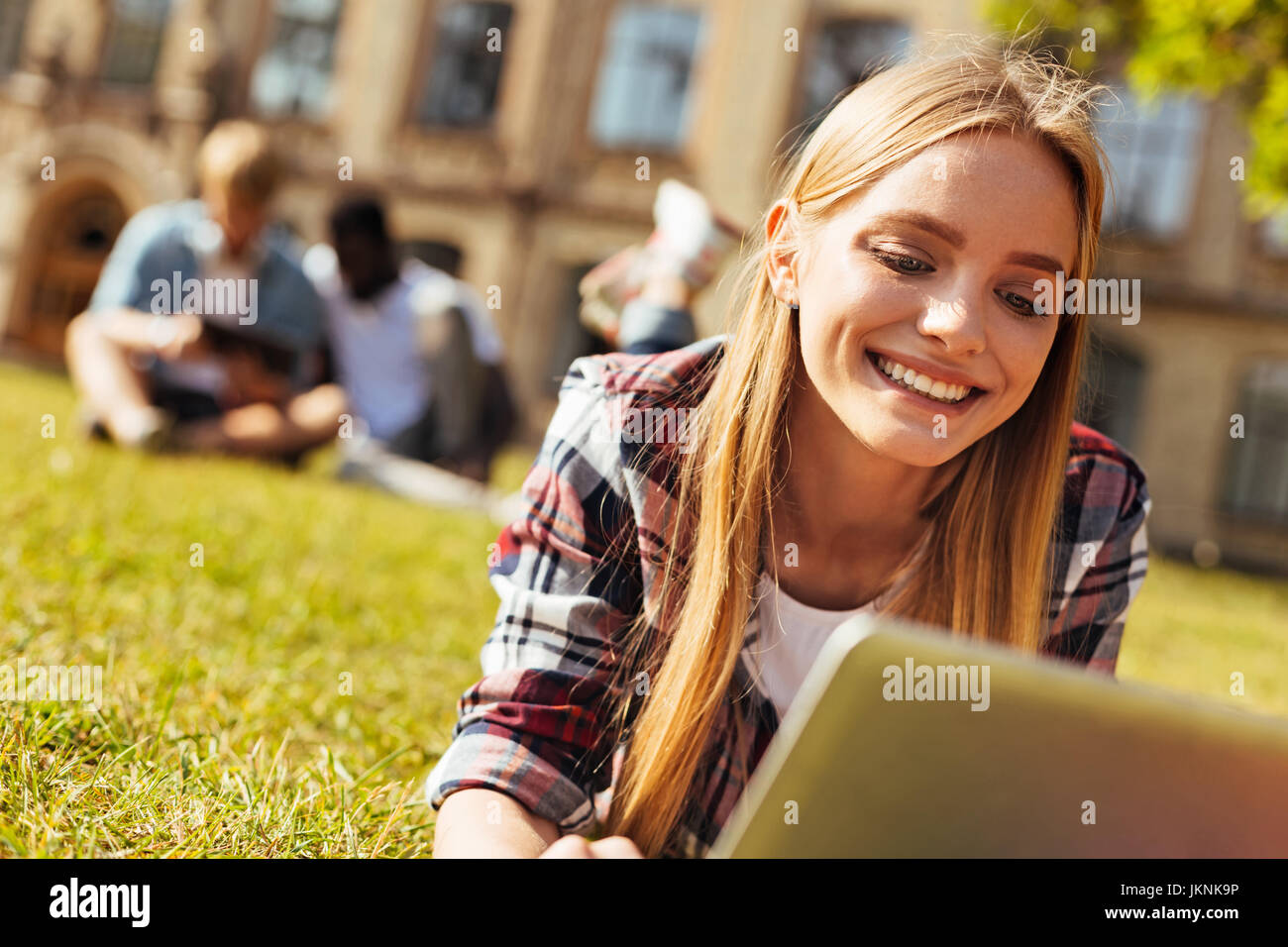Pretty fun girl answering the email Stock Photo - Alamy