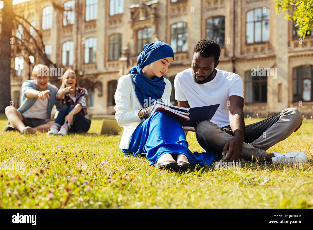 Open minded intelligent students supporting each other Stock Photo - Alamy