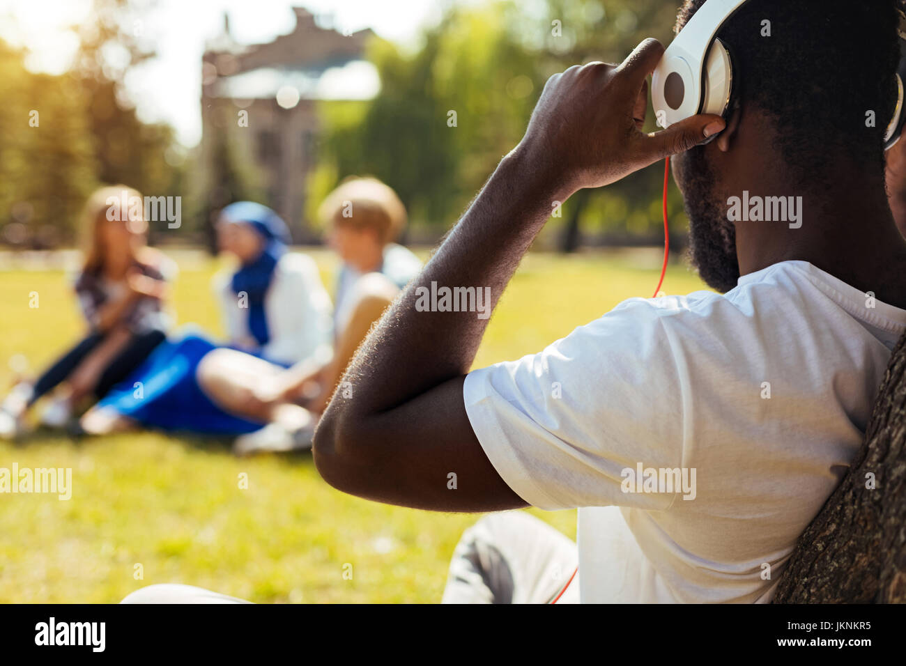 Charismatic creative guy listening to his favorite songs Stock Photo ...