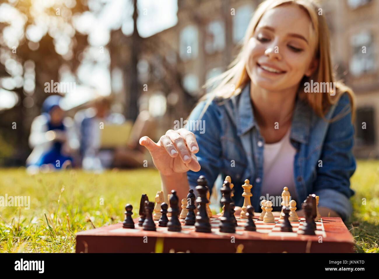 Logical unconventional woman making a move Stock Photo - Alamy