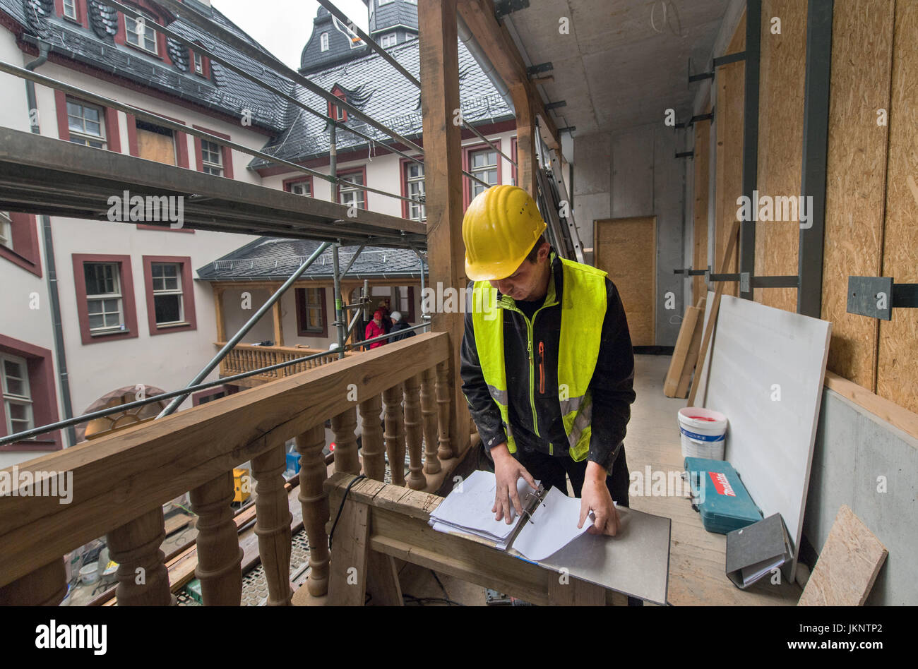 A carpenter controls the woodturned columns of the railing in Frankfurt ...