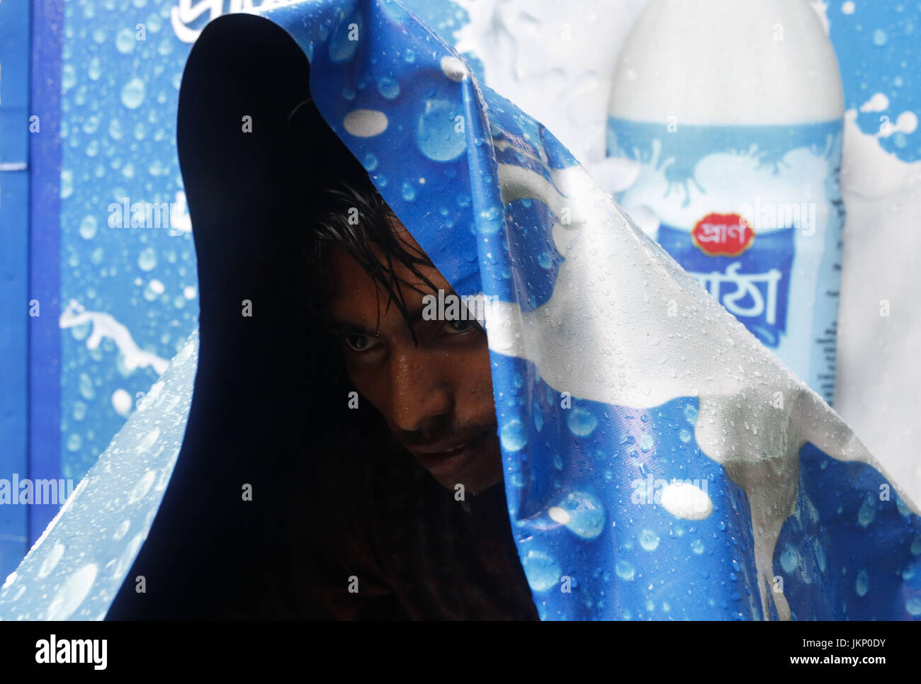 Dhaka, Bangladesh. 24th July, 2017. A van puller covered advertising ...