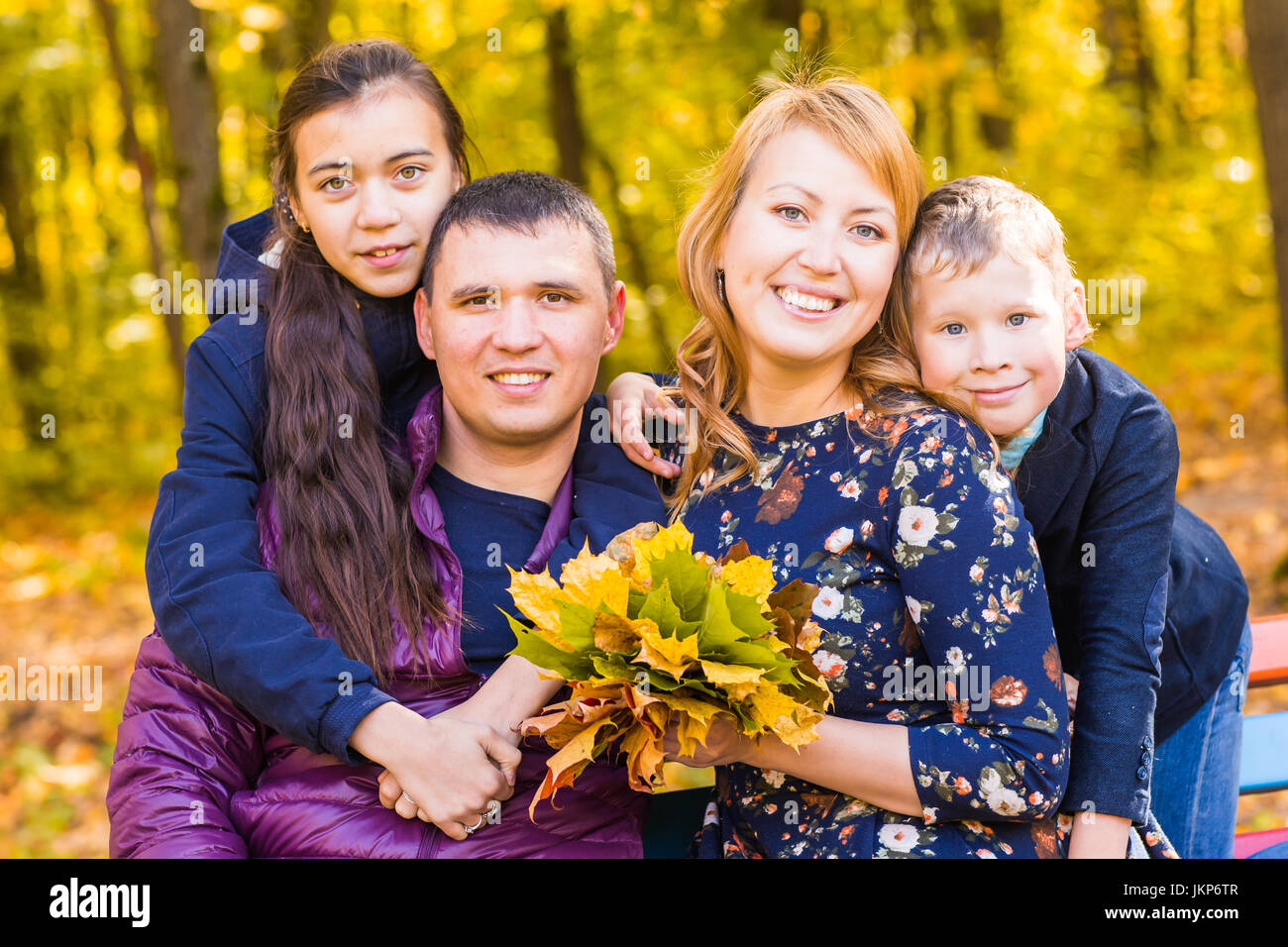 Family, nature, autumn and people concept - Portrait of Happy mother ...