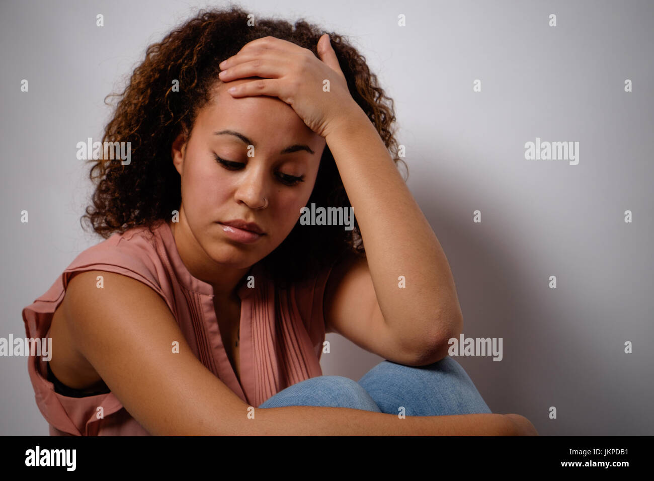 Sad afro-american woman portrait isolated on background Stock Photo - Alamy