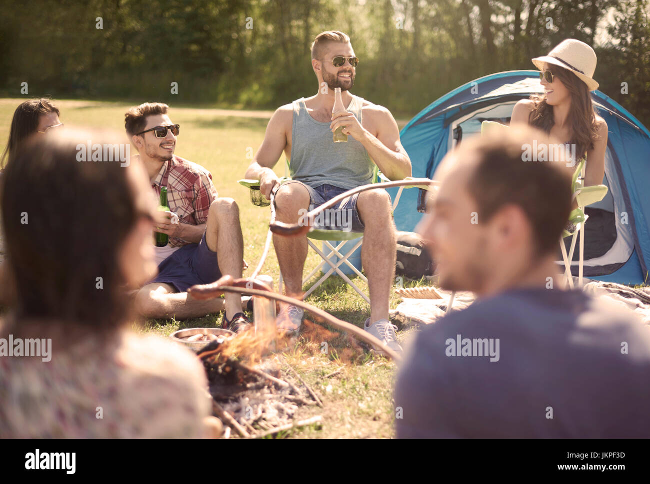 Friends relaxing on chair hi-res stock photography and images - Alamy