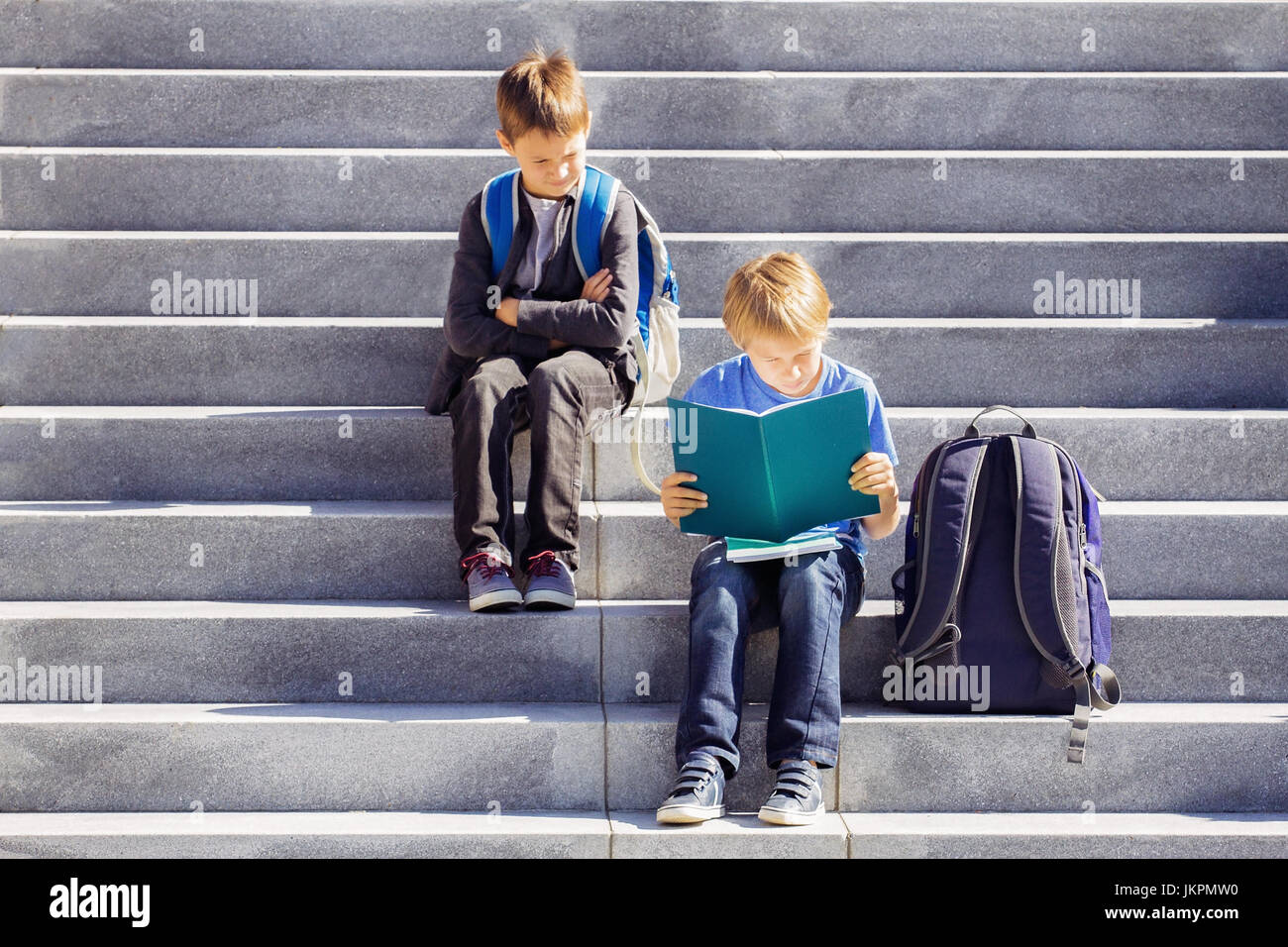 Two boys reading hi-res stock photography and images - Alamy