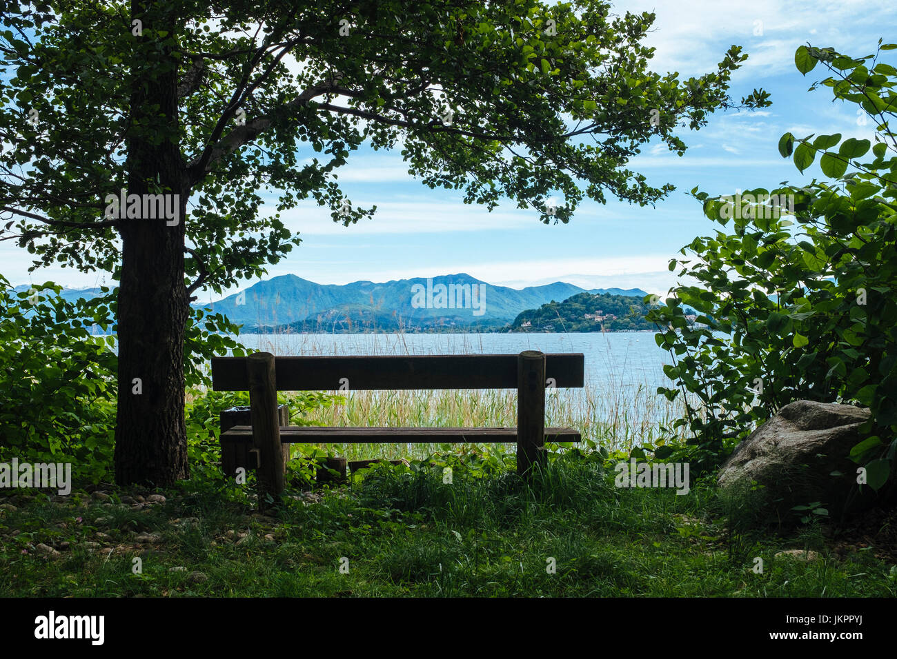 Public bench with lake view Stock Photo - Alamy