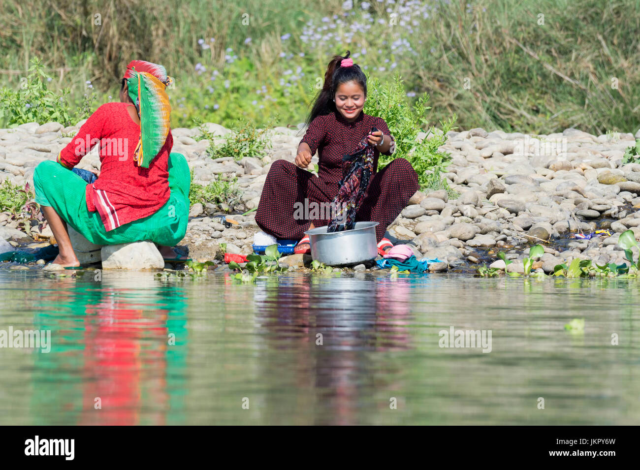 Women washing in river hi-res stock photography and images - Alamy